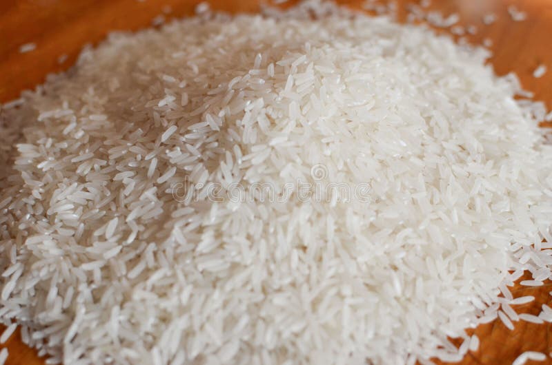 Uncooked Asian White Rice or Long White Rice Grain As Background Stock ...