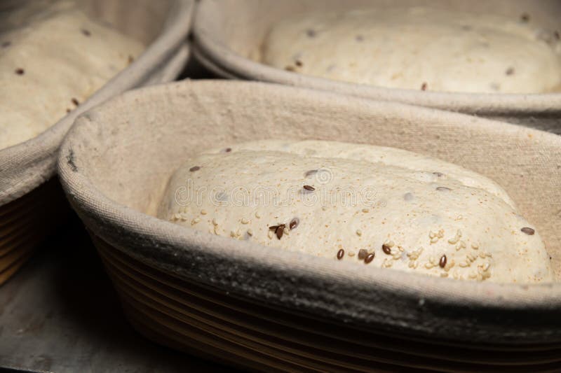 Uncooked Bread Dough with Sprinkles in Wooden Wicker Forms Covered with ...