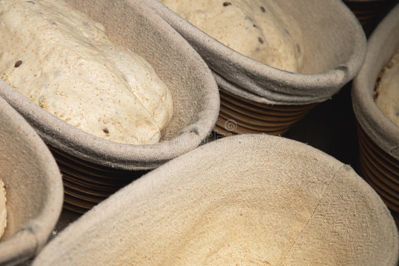 Uncooked Bread Dough with Sprinkles in Wooden Wicker Forms Covered with ...