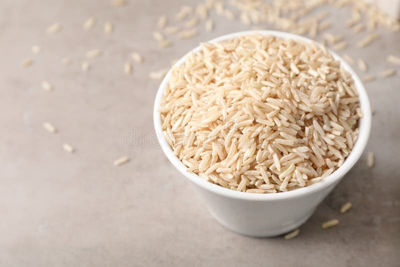 Uncooked Brown Rice in Small Bowl on Table Stock Photo - Image of ...
