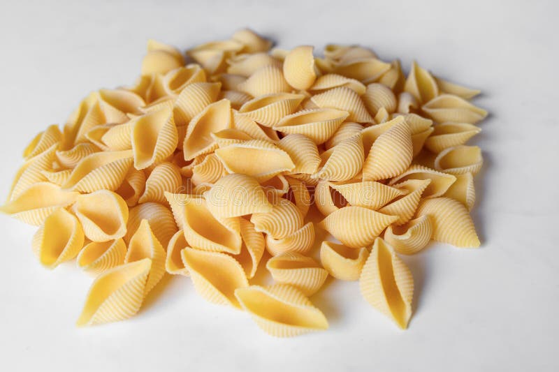Uncooked Dried Conchiglie. Pile of Shell Pasta Stock Image - Image of ...