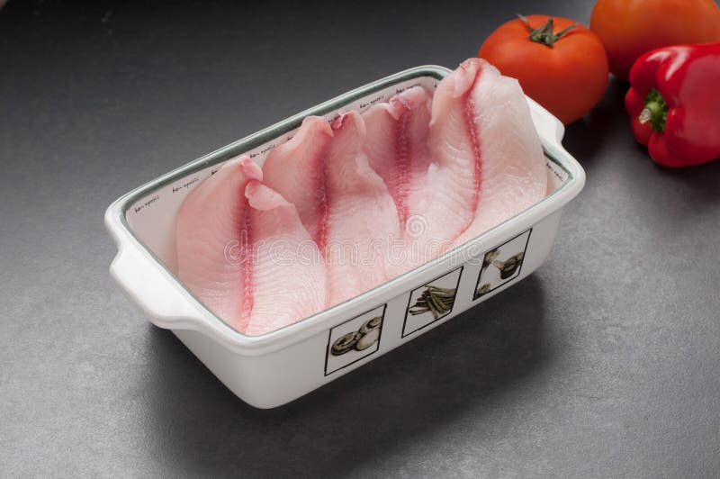 Uncooked fish fillets stock image. Image of casserole - 102231153