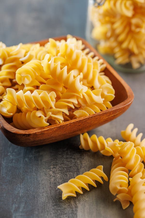Uncooked Fusilli Pasta. Uncooked Italian Pasta on Kitchen Table Stock ...