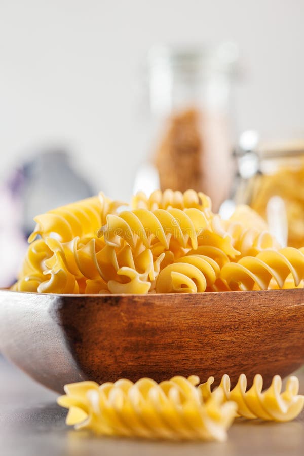 Uncooked Fusilli Pasta. Uncooked Italian Pasta on Kitchen Table Stock ...