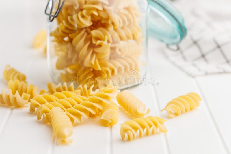 Uncooked Fusilli Pasta. Uncooked Italian Pasta on Kitchen Table Stock ...