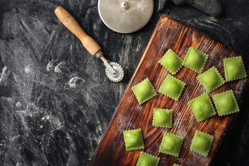 Uncooked Green Organic Ravioli Pasta on Kitchen Table Stock Photo ...