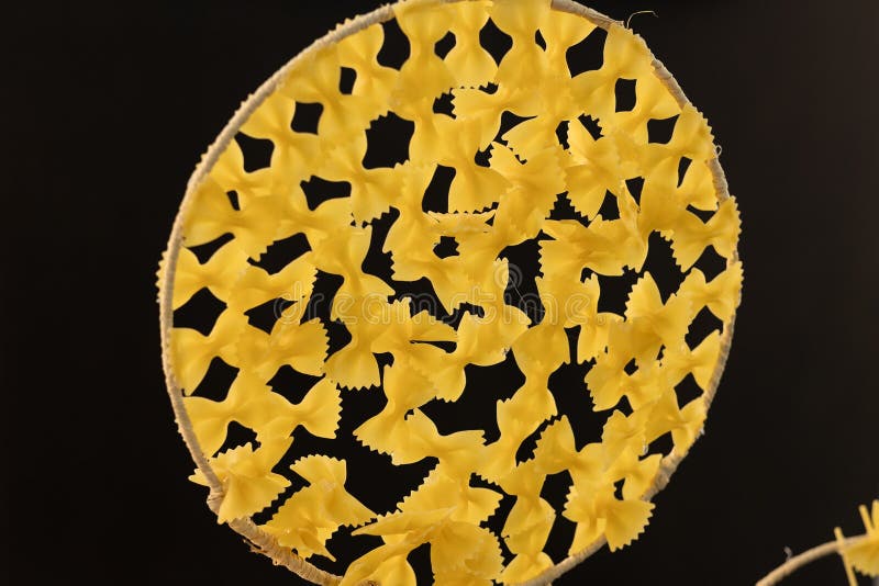 Uncooked Italian Pasta -Farfalle- Arranged in a Circle with Black ...