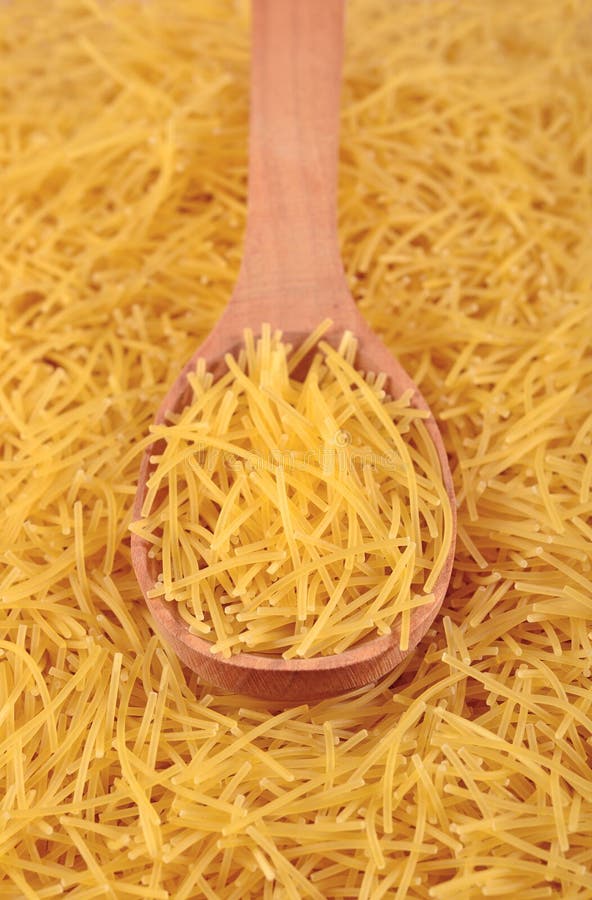 Uncooked Italian Pasta in a Spoon Stock Image - Image of texture, grain ...