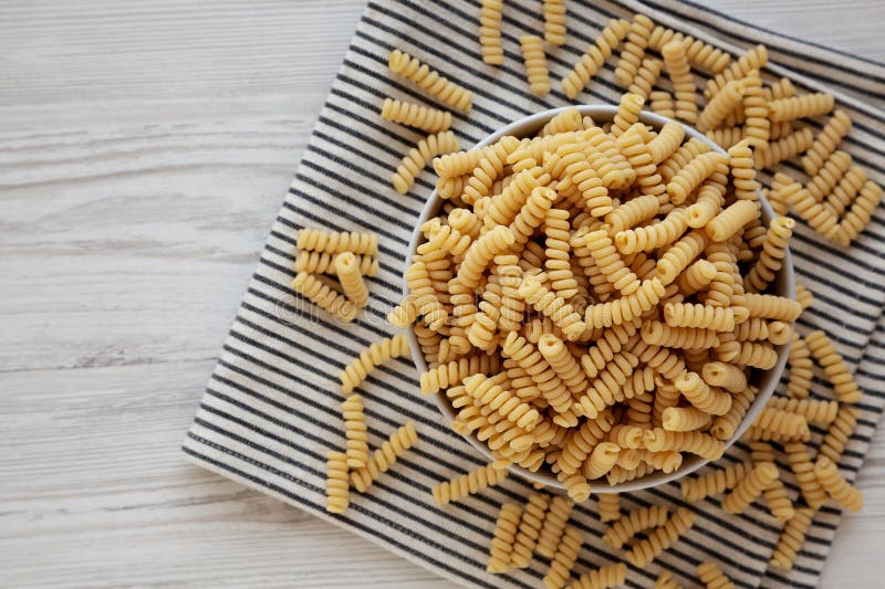 Uncooked Organic Dry Fusilli Pasta in a Bowl, Top View Stock Image ...