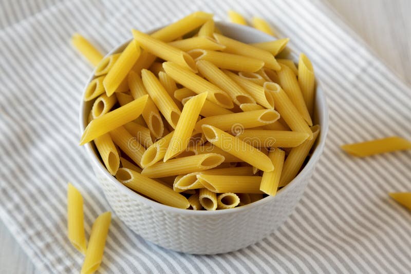 Uncooked Organic Penne Pasta in a Bowl, Side View Stock Image - Image ...