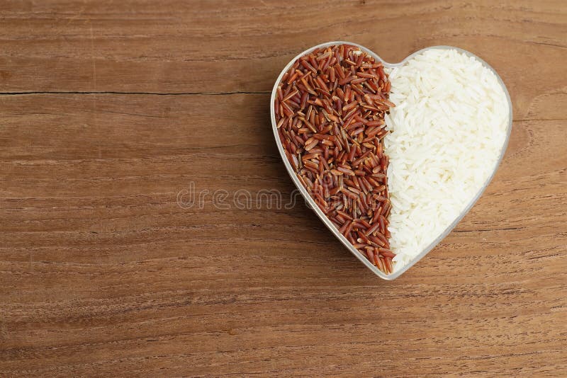 Uncooked Organic Rice and Red Rice in a Plastic Bowl Stock Image ...