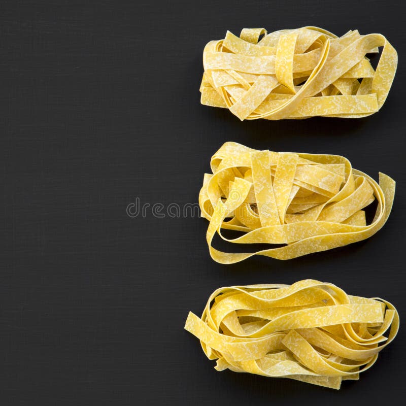 Uncooked Pasta Pappardelle on a White Wooden Table, Top View. Overhead ...