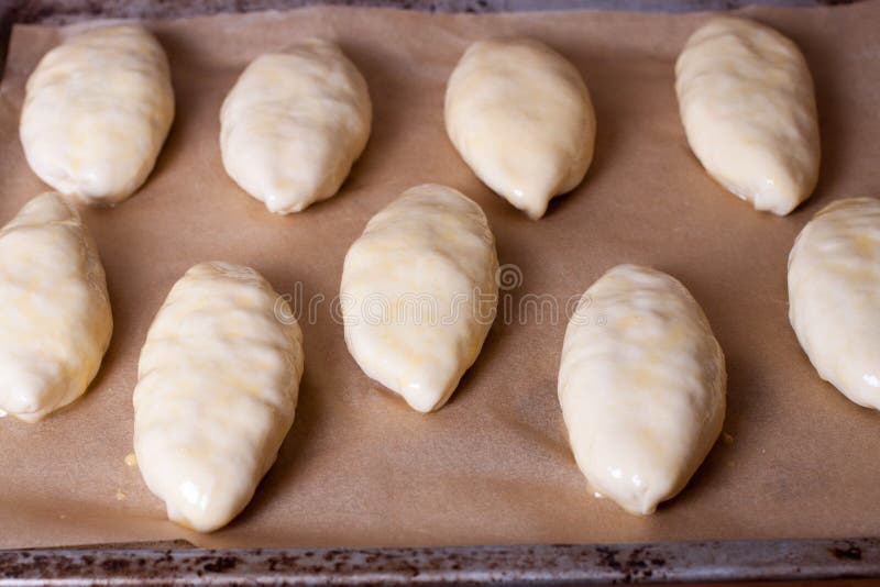 Uncooked Pies on a Baking Sheet Stock Photo - Image of kitchen, bakery ...