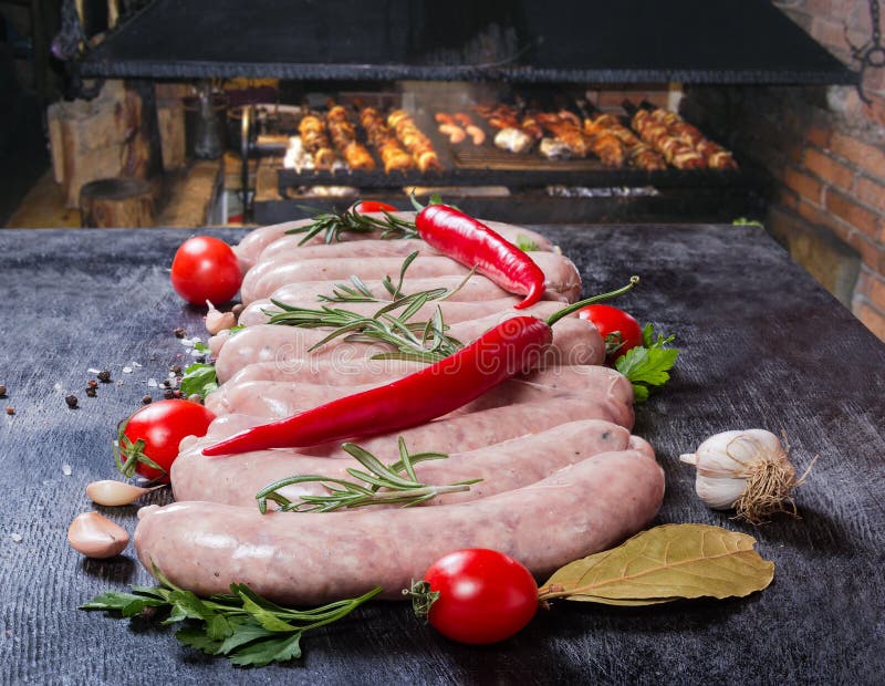 Uncooked Pork Sausages Spices On Dark Surface Against Charcoal Grill Stock Image Image Of