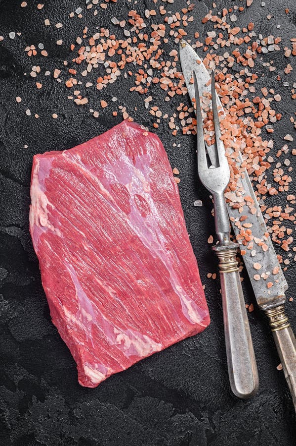 Uncooked Raw Flap Flank Beef Meat Steak on Kitchen Table. Black ...