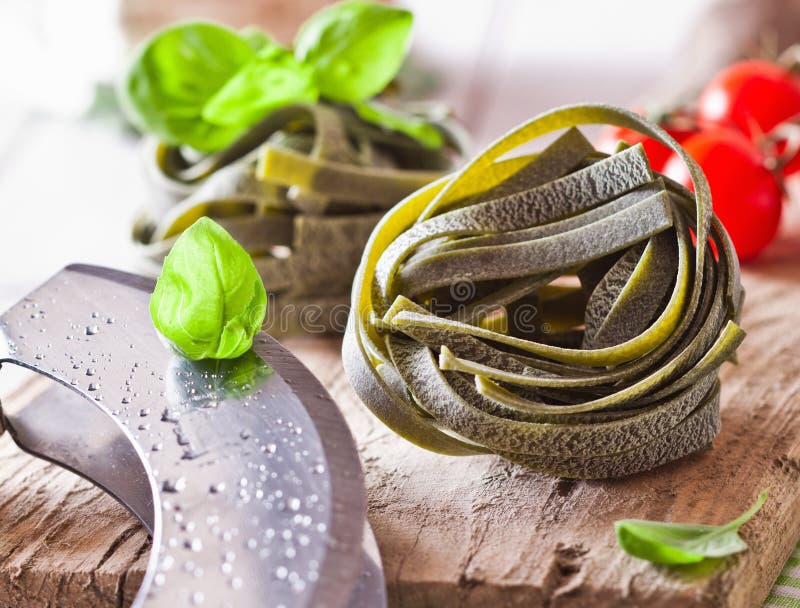 Uncooked Ribbon Tagliatelle Pasta Stock Photo - Image of wooden, fresh ...