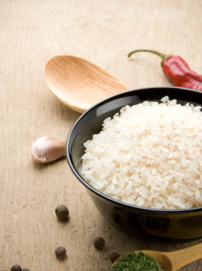 Uncooked rice in bowl stock image. Image of sort, healthy - 22200243