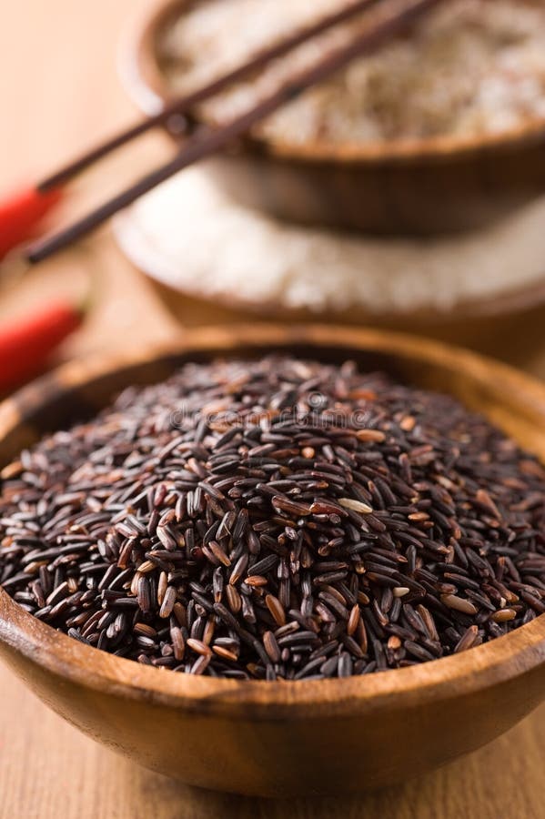 Uncooked rice in bowls stock image. Image of japanese - 22707207