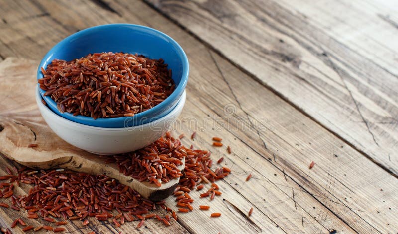 Uncooked rice in bowls stock image. Image of organic - 120634825