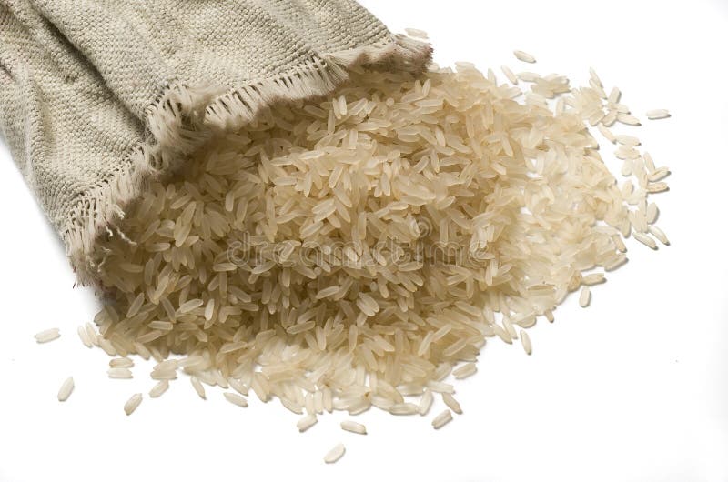 Uncooked Rice Grains Spilled on the Table from a Burlap Sack Stock ...