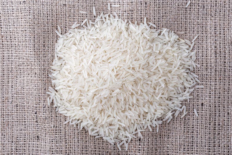 Uncooked rice is scattered stock photo. Image of organic - 84182196