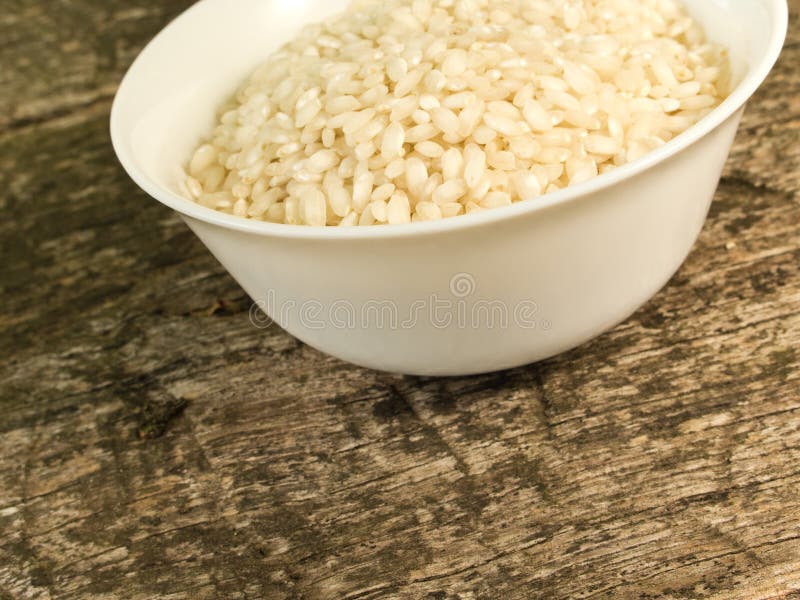 Uncooked rice stock photo. Image of oriental, container - 56338738