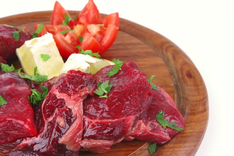 Uncooked small beef chunks stock photo. Image of board - 10404822