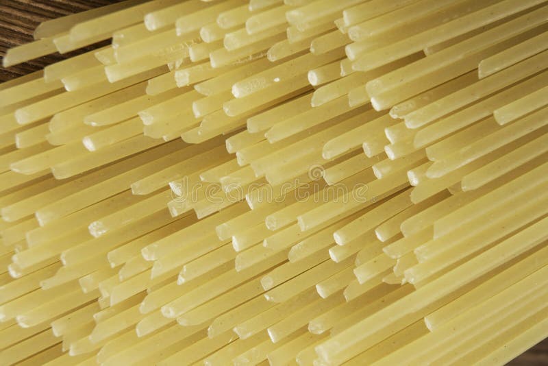 Uncooked Spaghetti on Table Stock Photo - Image of uncooked, cooking ...