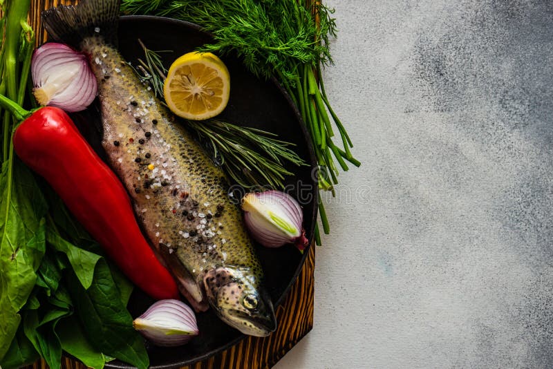 Uncooked trout fish stock image. Image of herb, cook - 174098191