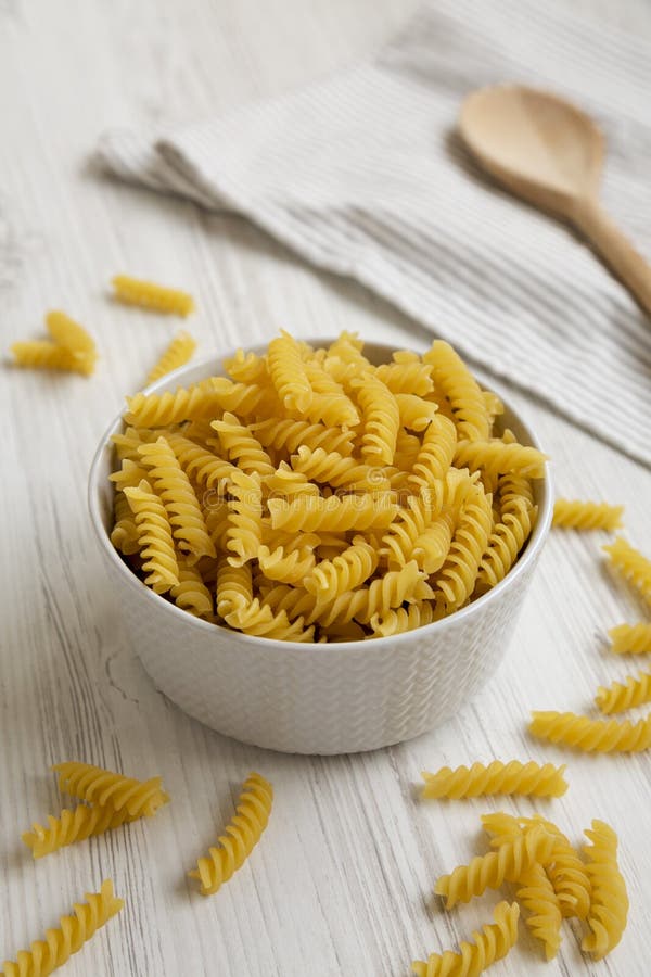 Uncooked Yellow Organic Rotini Pasta, Side View Stock Photo - Image of ...
