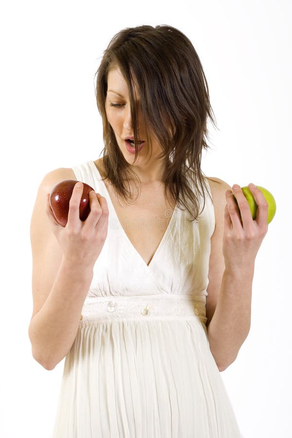 Undecided Woman Picks an Apple Stock Photo - Image of selective, smith ...