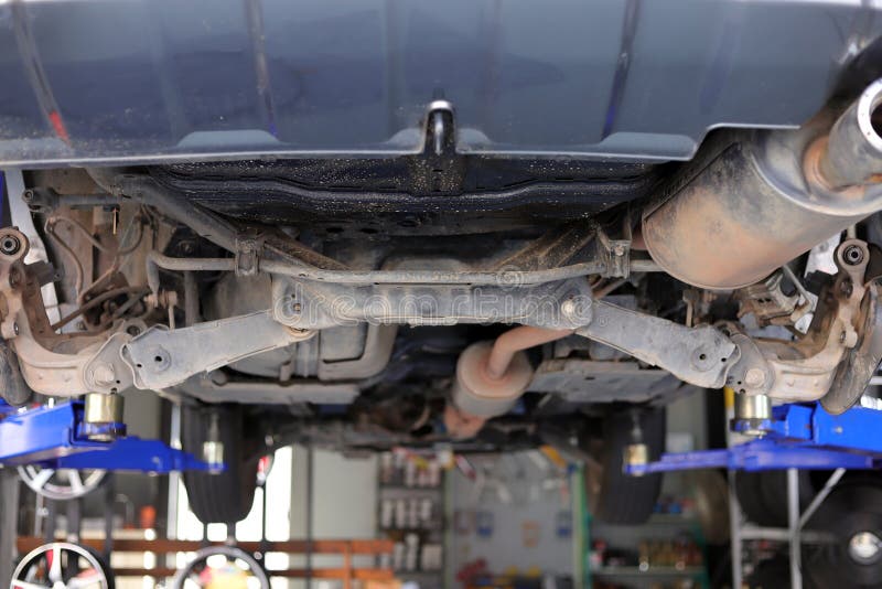 Under the Car in Car Garage Stock Image - Image of effort, american ...