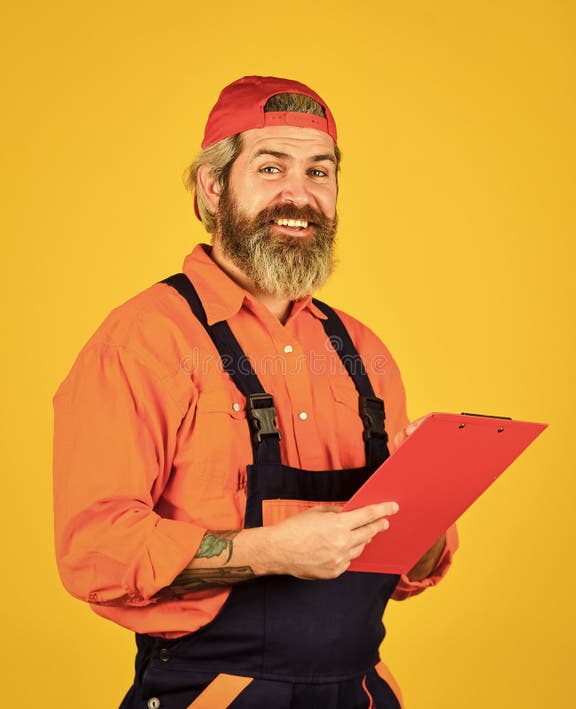 Under Construction. Builder with Data Folder. Worker with the Folder in ...