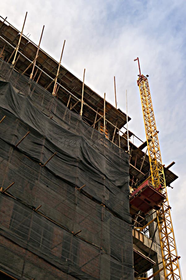 Under Construction Building with Black Protective Netting Surrounding a ...