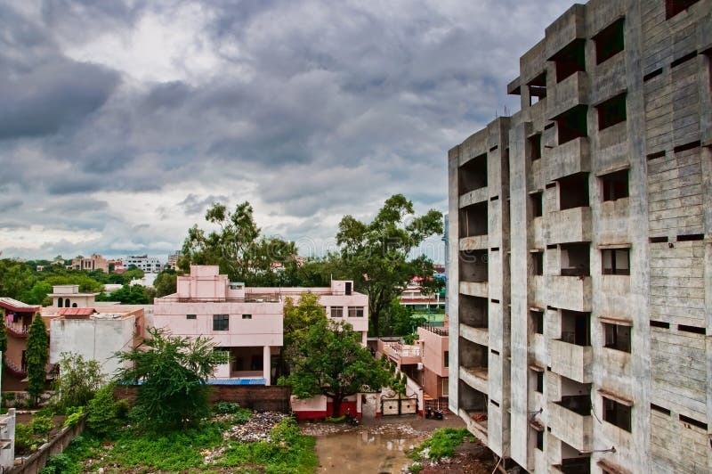 Under Construction Building with Clouds and Trees Stock Photo - Image ...