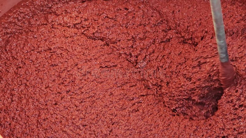 Under Construction. Close-up of a Mixer Mixing Material in a Vessel ...