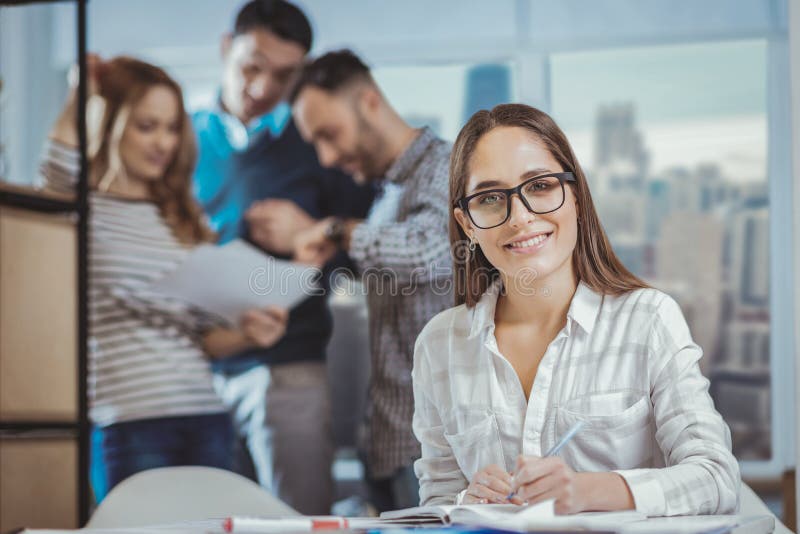 Optimistic Female Colleague Recording Ideas Stock Image - Image of ...
