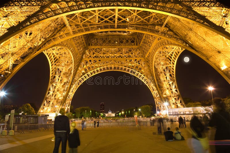 Under the Eiffel Tower Illuminated at Night Editorial Photography ... Under the Eiffel Tower Illuminated at Night Editorial Photography ...