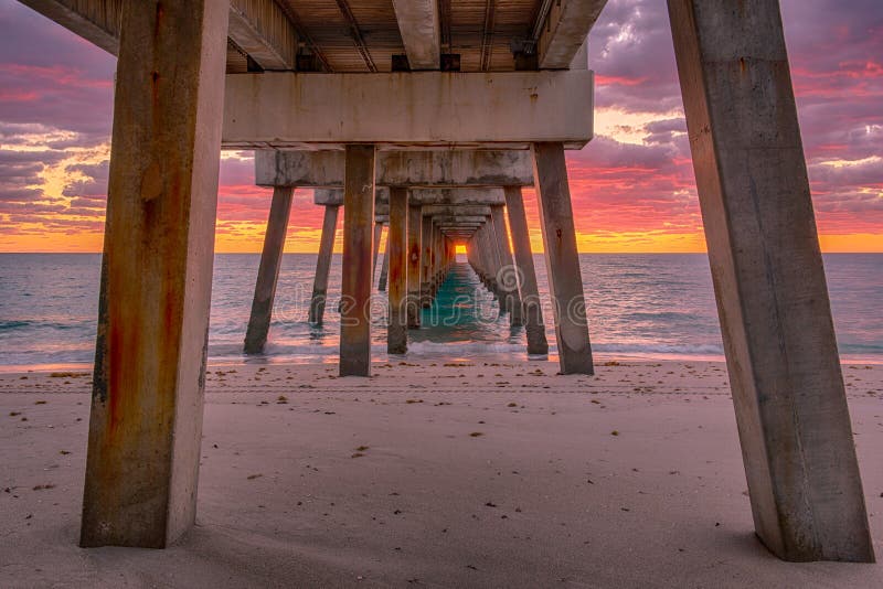 Under Juno Beach pier stock image. Image of super, sunset - 145780055