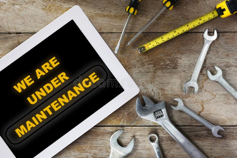 We are Under Maintenance Written on Computer Digital Tablet with Tools ...