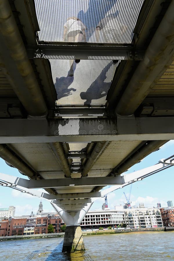 See People Walking Above. Skyline Taken Under the Millennium Bridge ...
