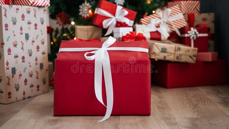 Elegantly Wrapped Gift with a Large Red Bow on Top, White Background ...
