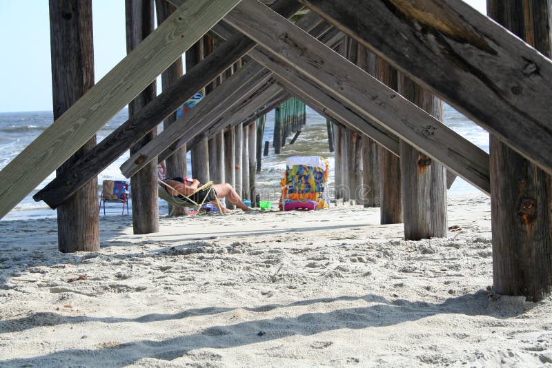 Under the pier stock photo. Image of ocean, water, woman - 1278368