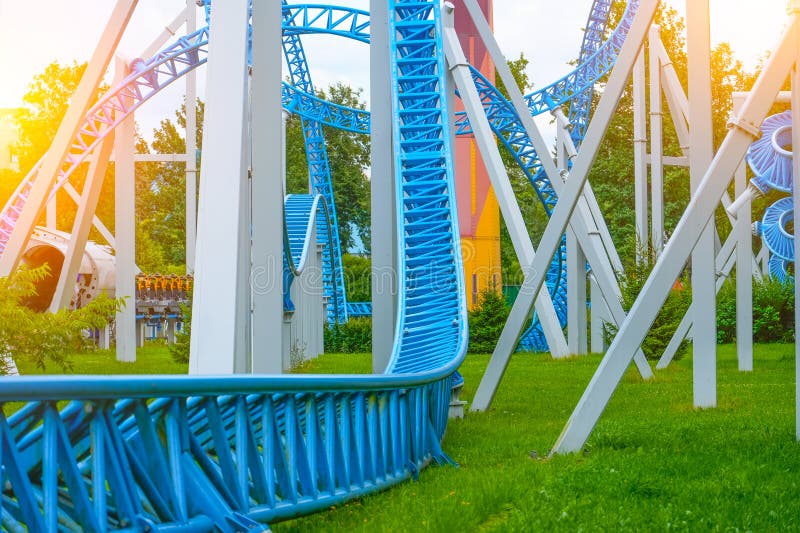 Under View Blue Roller Coaster Up Down Turn and a Passing Loop Feint ...