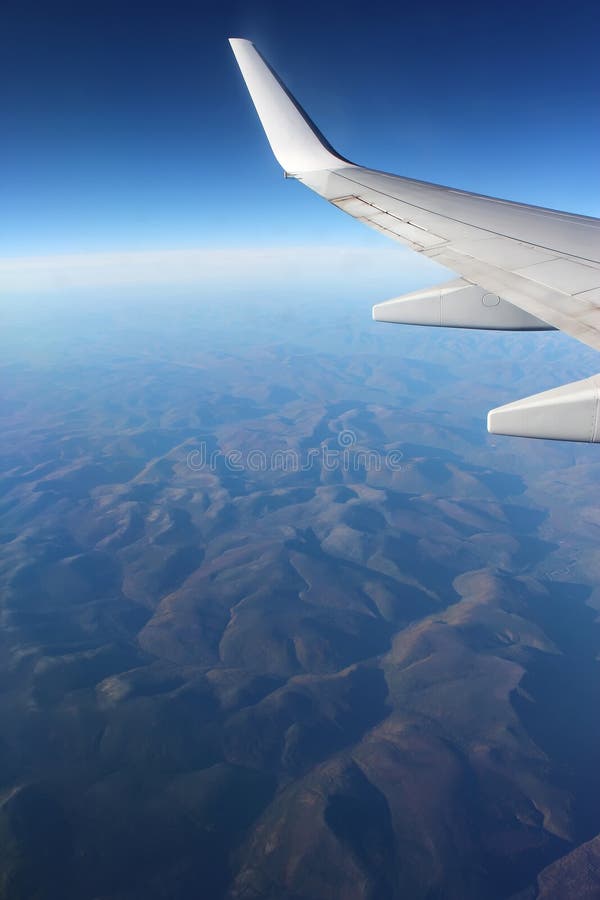 Under the Wing of the Plane Stock Image - Image of airplane, tourism ...