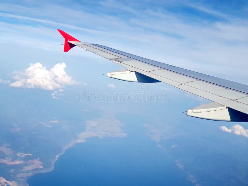 Under the Wing of the Plane. Panoramic View of the Blue Sky with Clouds ...