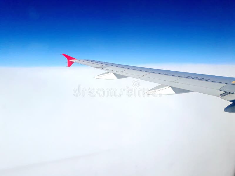 Under the Wing of the Plane. Panoramic View of the Blue Sky with Clouds ...