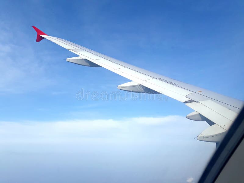 Under the Wing of the Plane. Panoramic View of the Blue Sky with Clouds ...