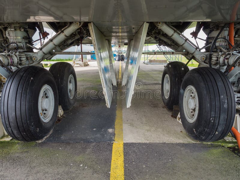 Undercarriage of jumbo jet stock image. Image of airport - 34814589