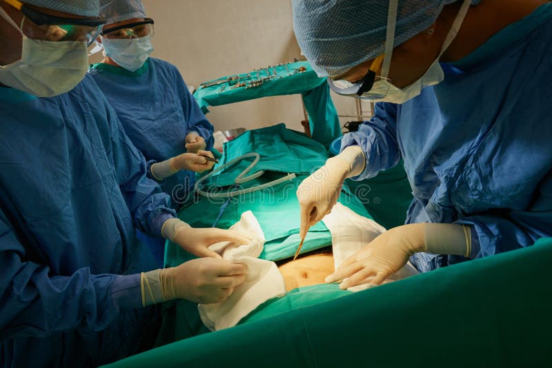 Undergoing Surgical Treatment. a Surgeon Making an Incision with a ...